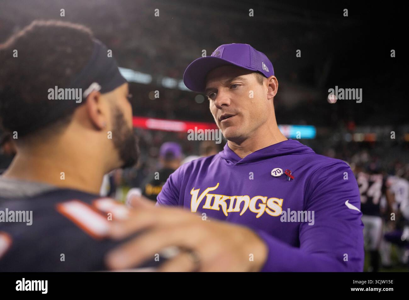 Minnesota Vikings head coach Kevin O'Connell talks with Chicago Bears quarterback Caleb Williams ...