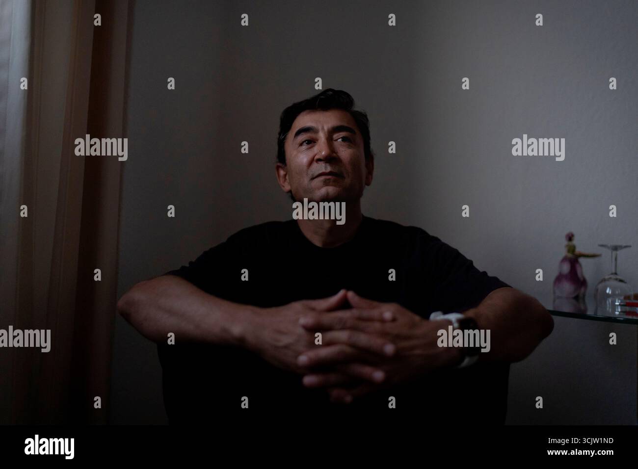 Former Xinjiang government engineer Nureli Abliz, sits for a portrait ...