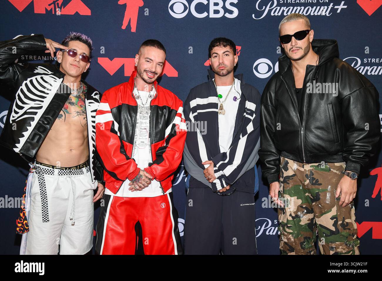 Lenny Tavárez, J Balvin, Justin Quiles, and DJ Snake posing in the ...