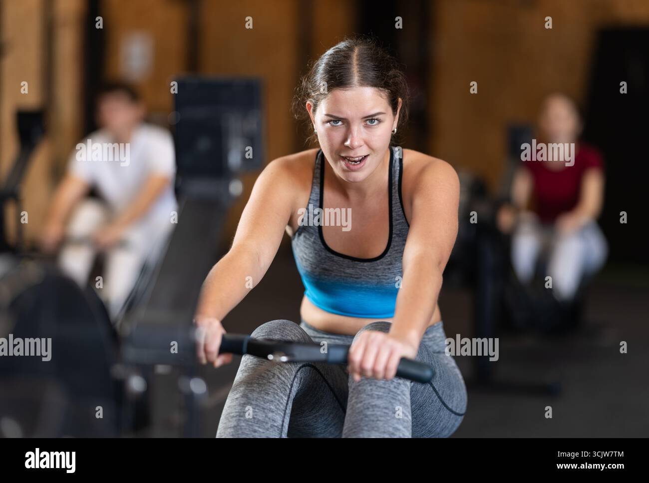 Rowing woman on ergometer hi-res stock photography and images - Alamy