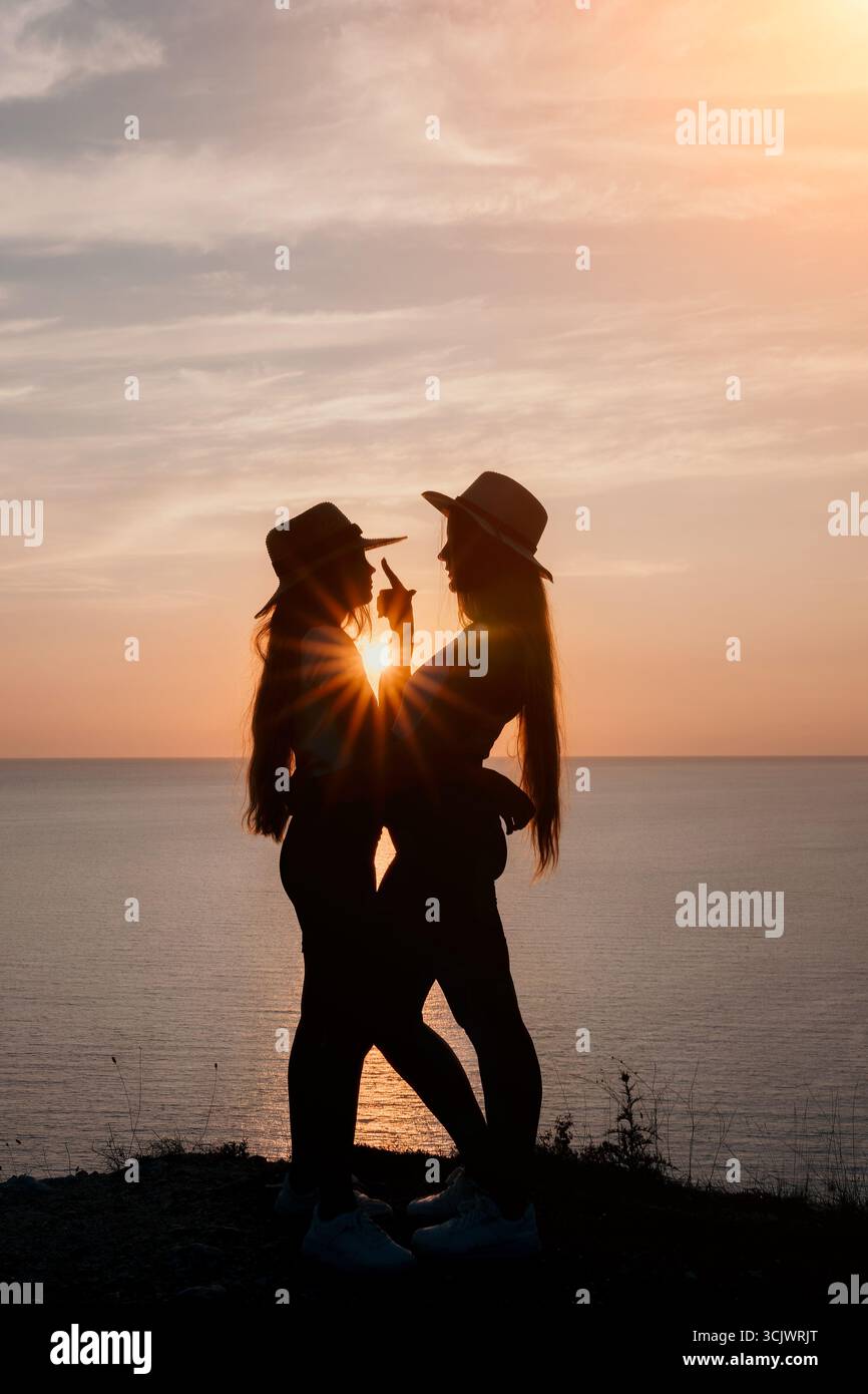 Woman travel sea. Happy carefree woman with long hair in straw hats ...