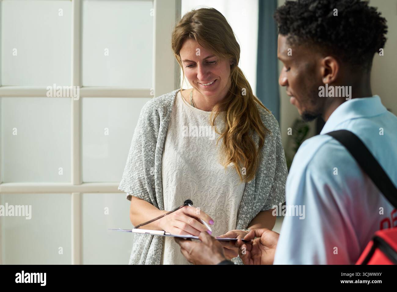Male client receiving face hi-res stock photography and images - Alamy