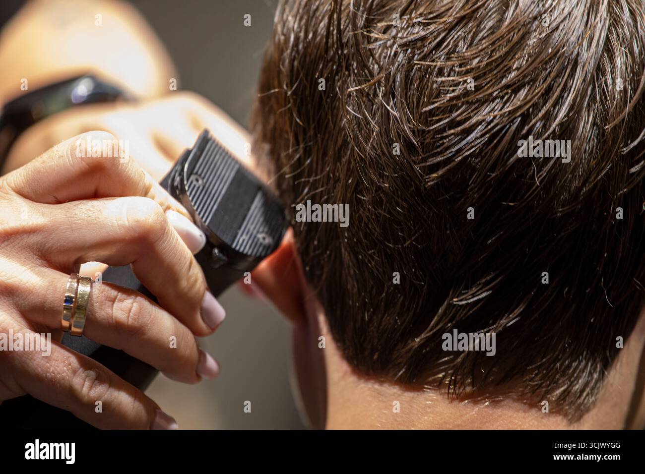 shave off the remaining hair on the back of the head and under the ears ...