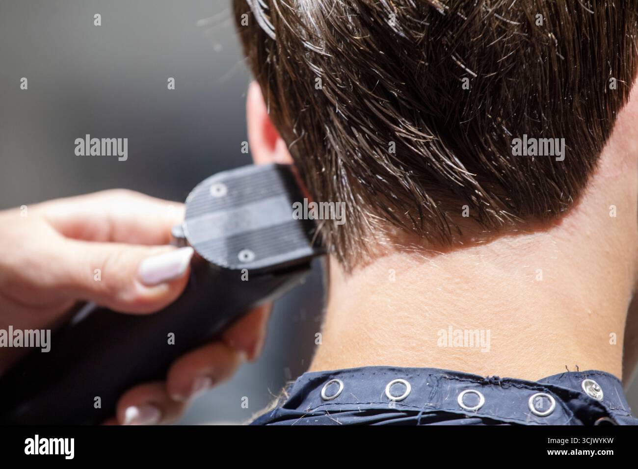 shave off the remaining hair on the back of the head and under the ears ...