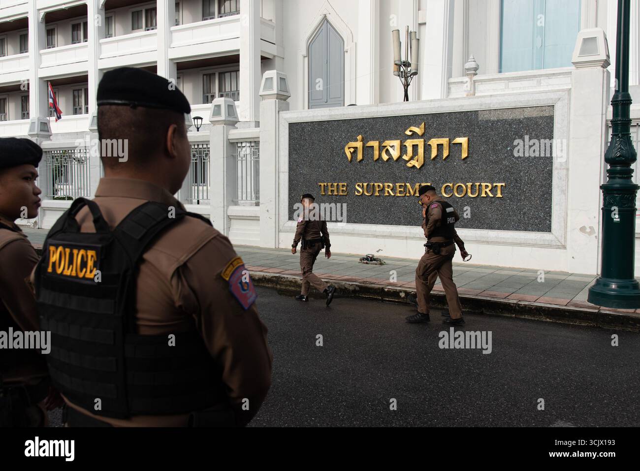 Policemen stand on guard outside the Thailand's Supreme Court in Bangkok. The Thailand's Supreme ...