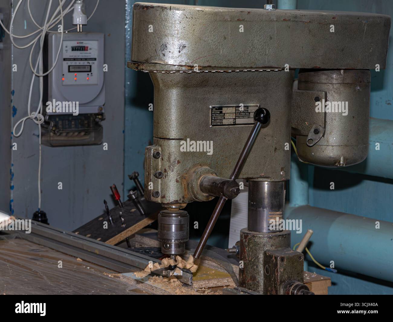 Vintage industrial drilling machine with visible wear and operational ...