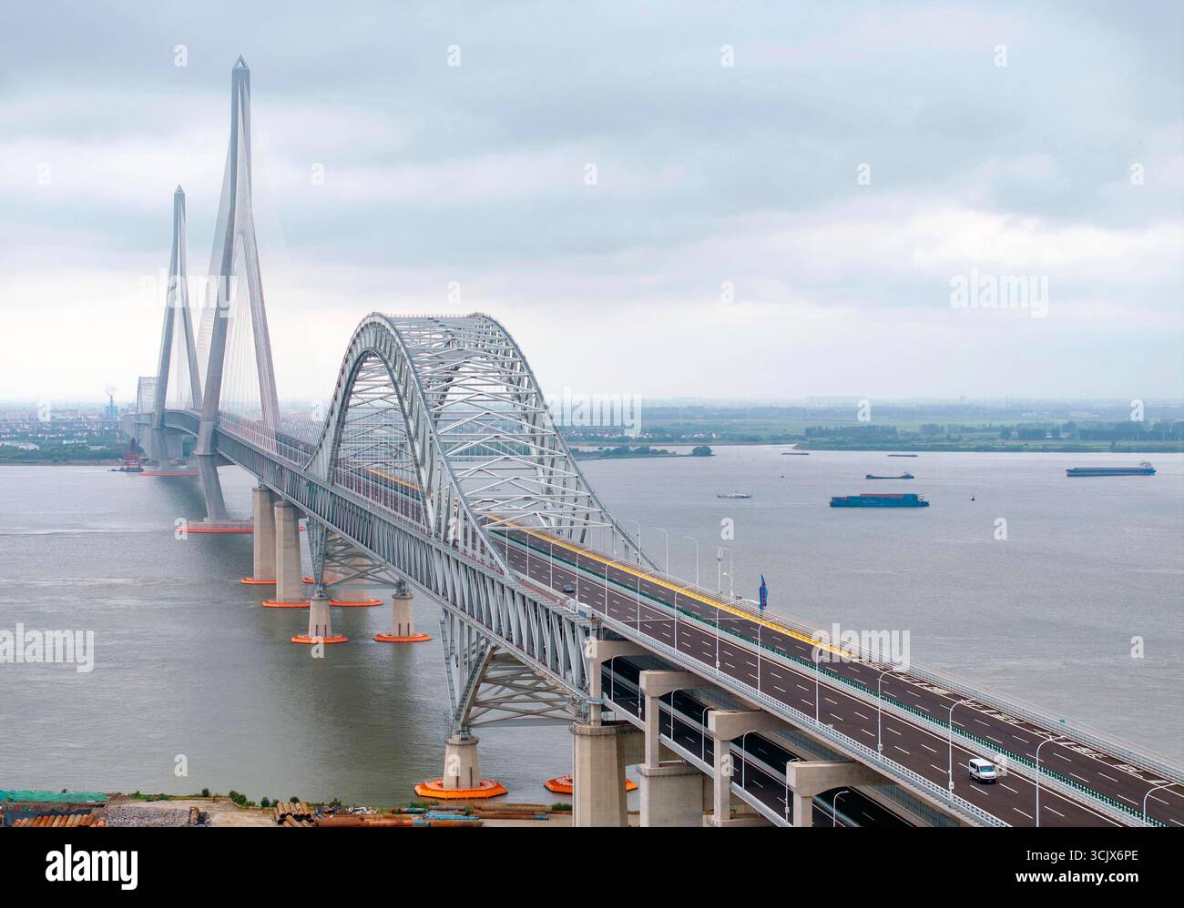 An aerial view shows traffic crossing the Changtai Yangtze River Bridge ...