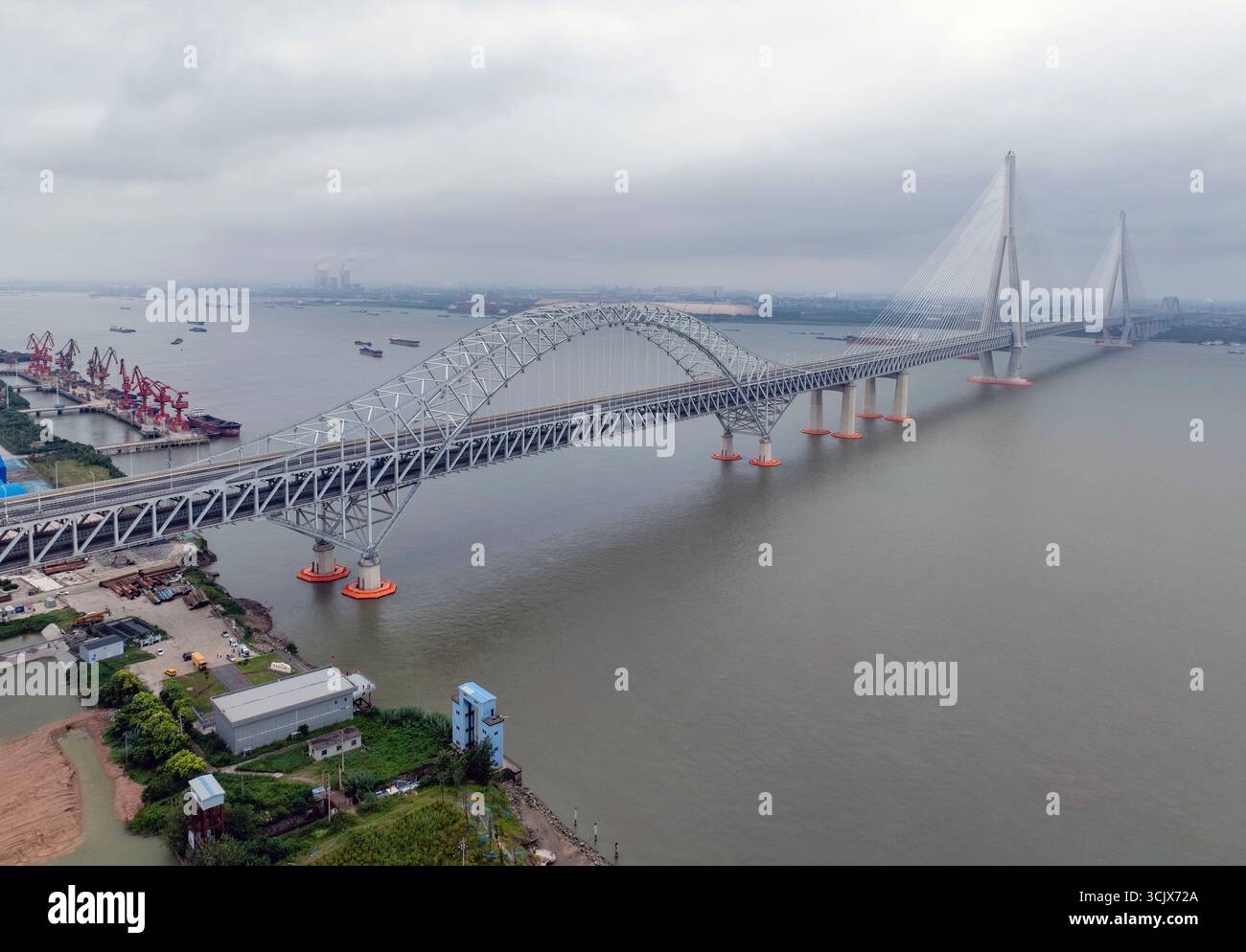 An aerial view shows traffic crossing the Changtai Yangtze River Bridge ...
