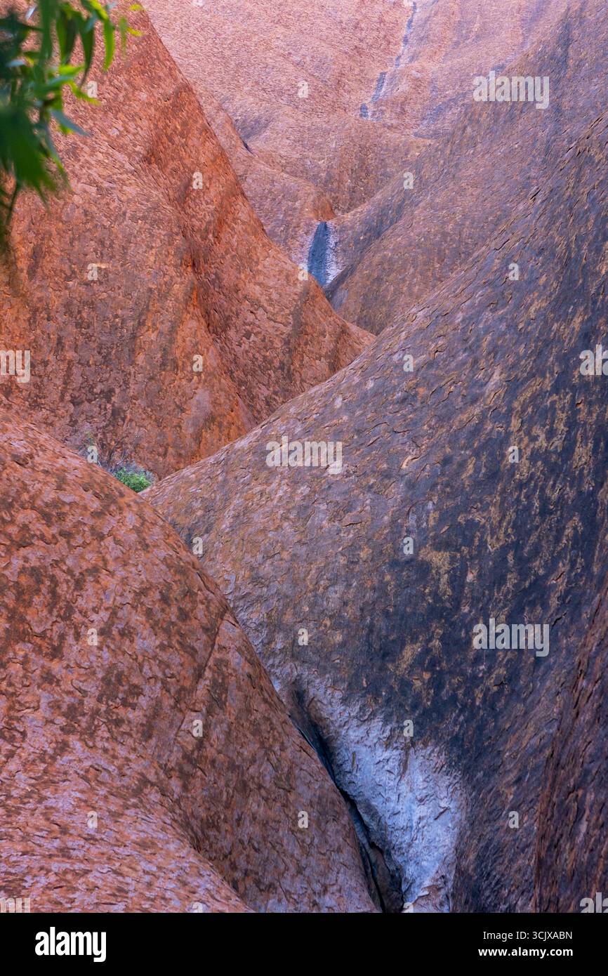 View of the monolithic rock formation, with its deep crevices and ...