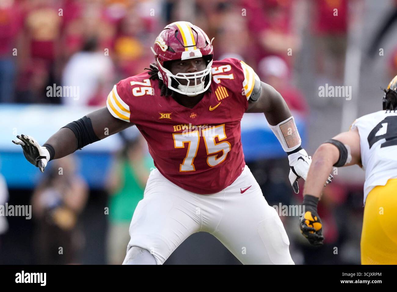Iowa State offensive lineman James Neal III (75) looks to make a block ...