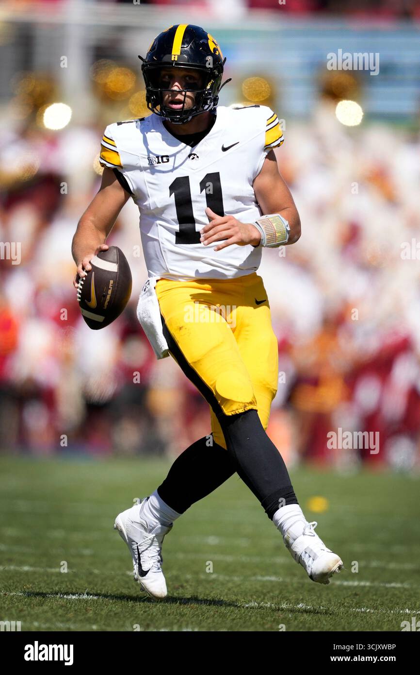 Iowa quarterback Mark Gronowski scrambles up field during the first ...