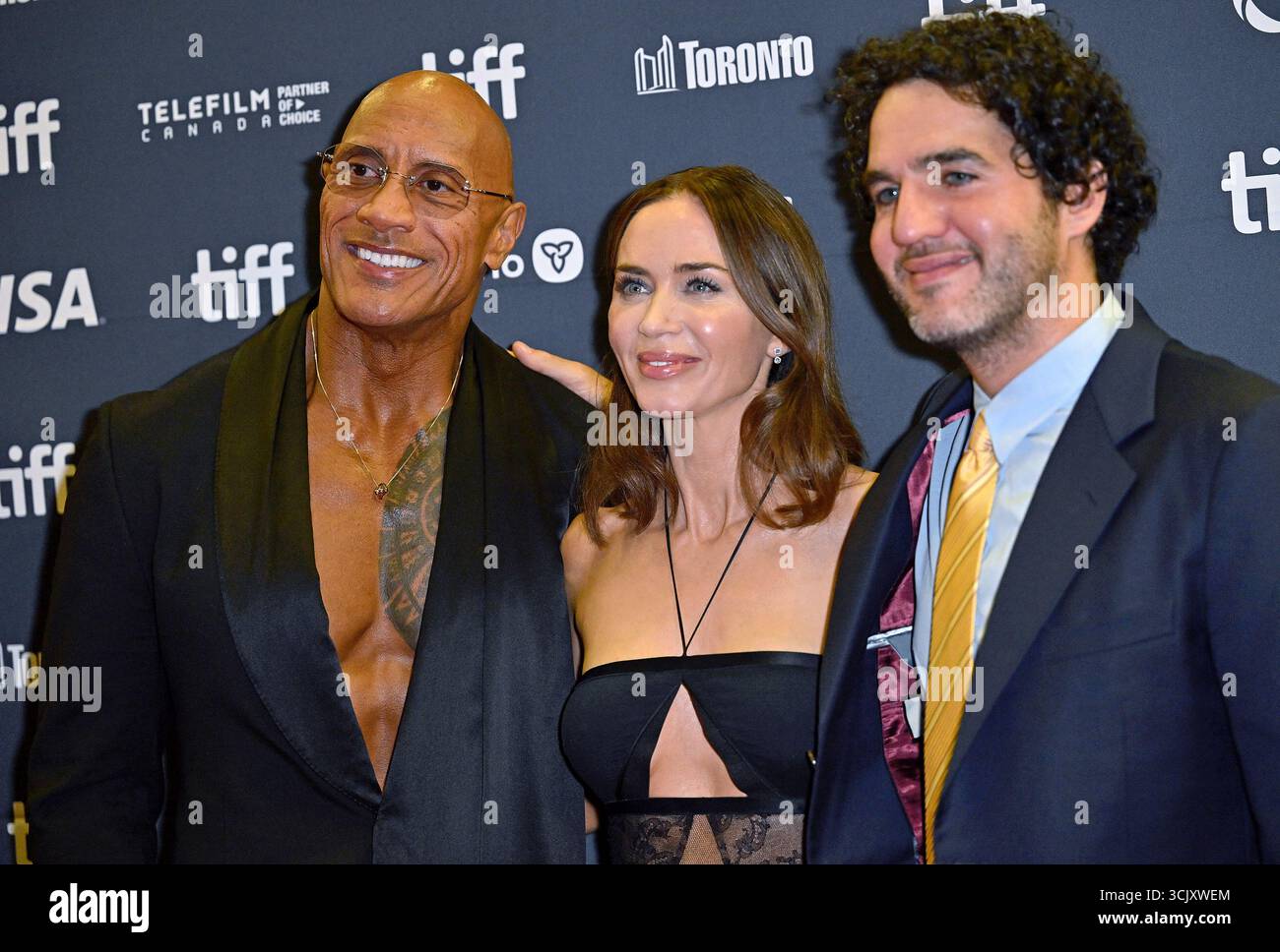 (L-R) Dwayne Johnson, Emily Blunt and director Benny Safdie attend the ...