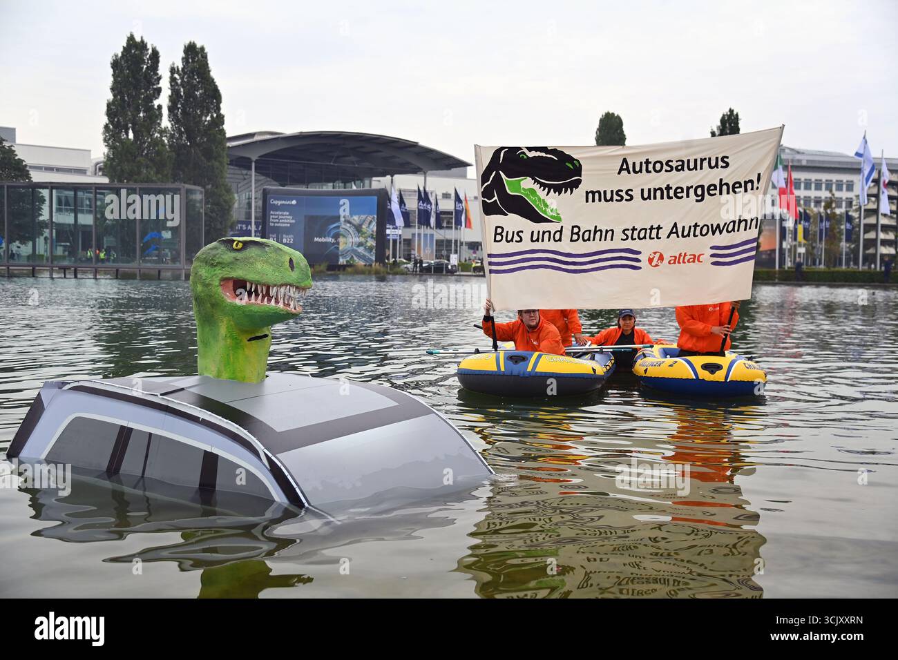 Attac protest: The car is the problem! Attac is sinking the AUTOSAURUS ...
