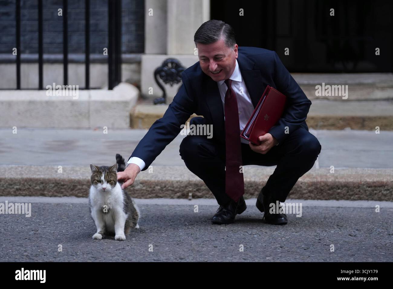Douglas Alexander, Secretary of State for Scotland, strokes Larry the ...
