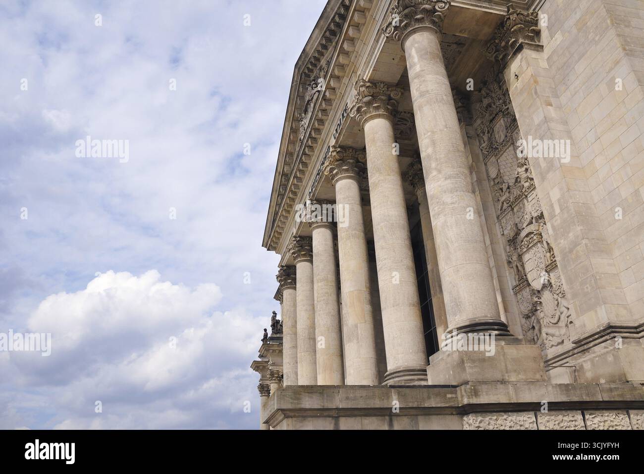 Side view to Berlin Reichstag with cloudy sky background Stock Photo ...