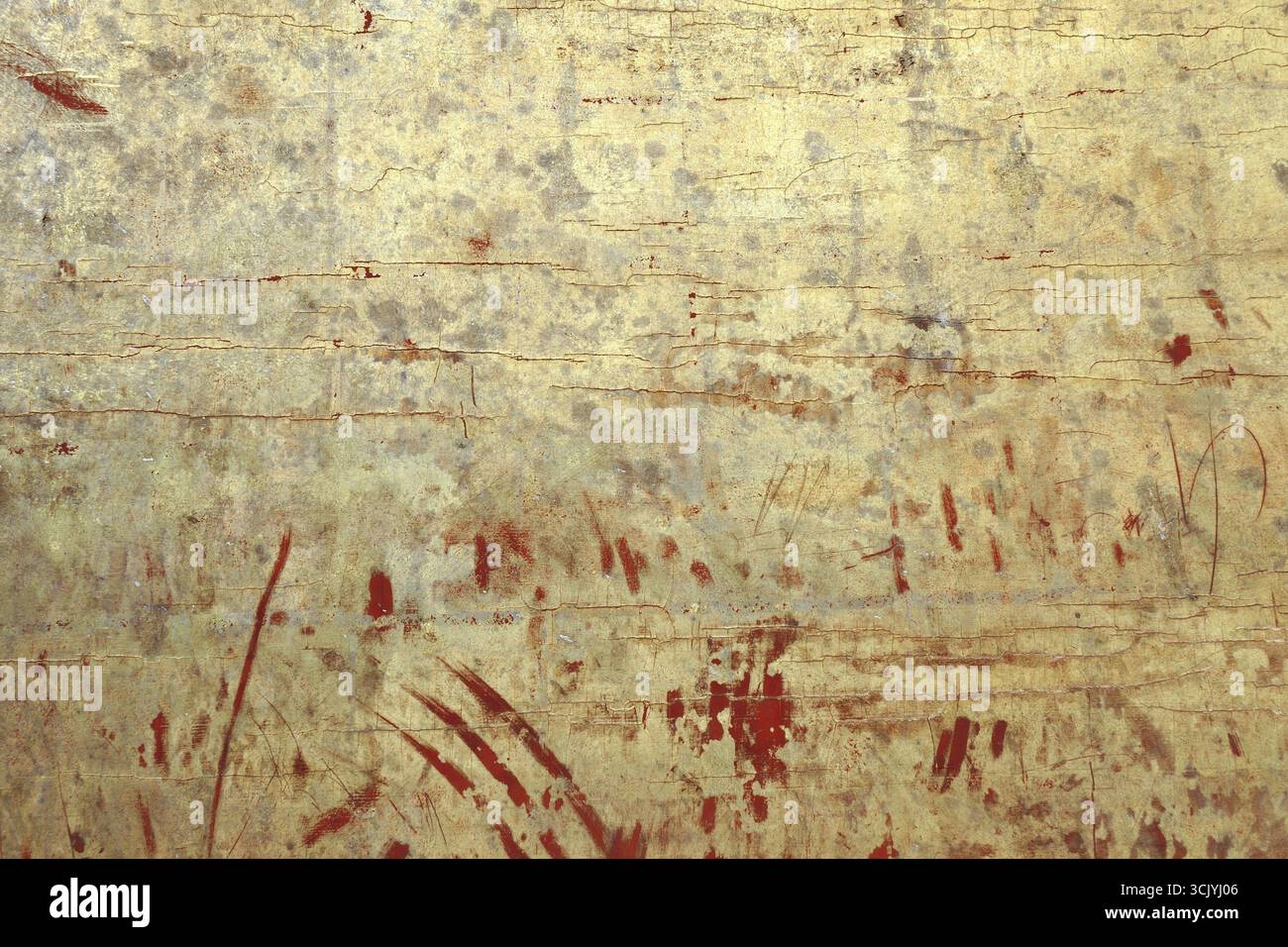 Ancient temple wall background with scratched golden color over old red ...