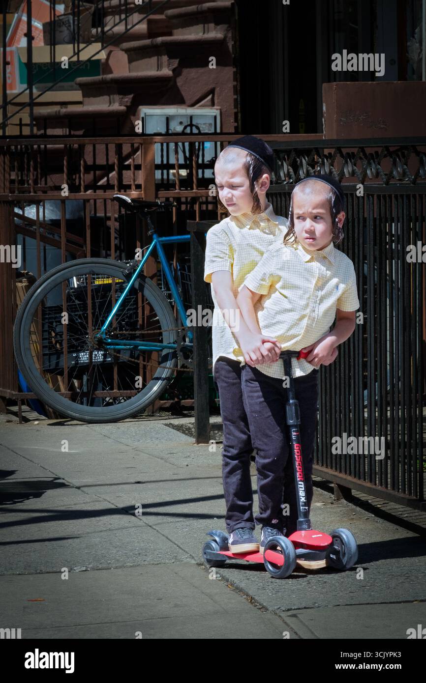 Ride scooter brothers hi-res stock photography and images - Alamy