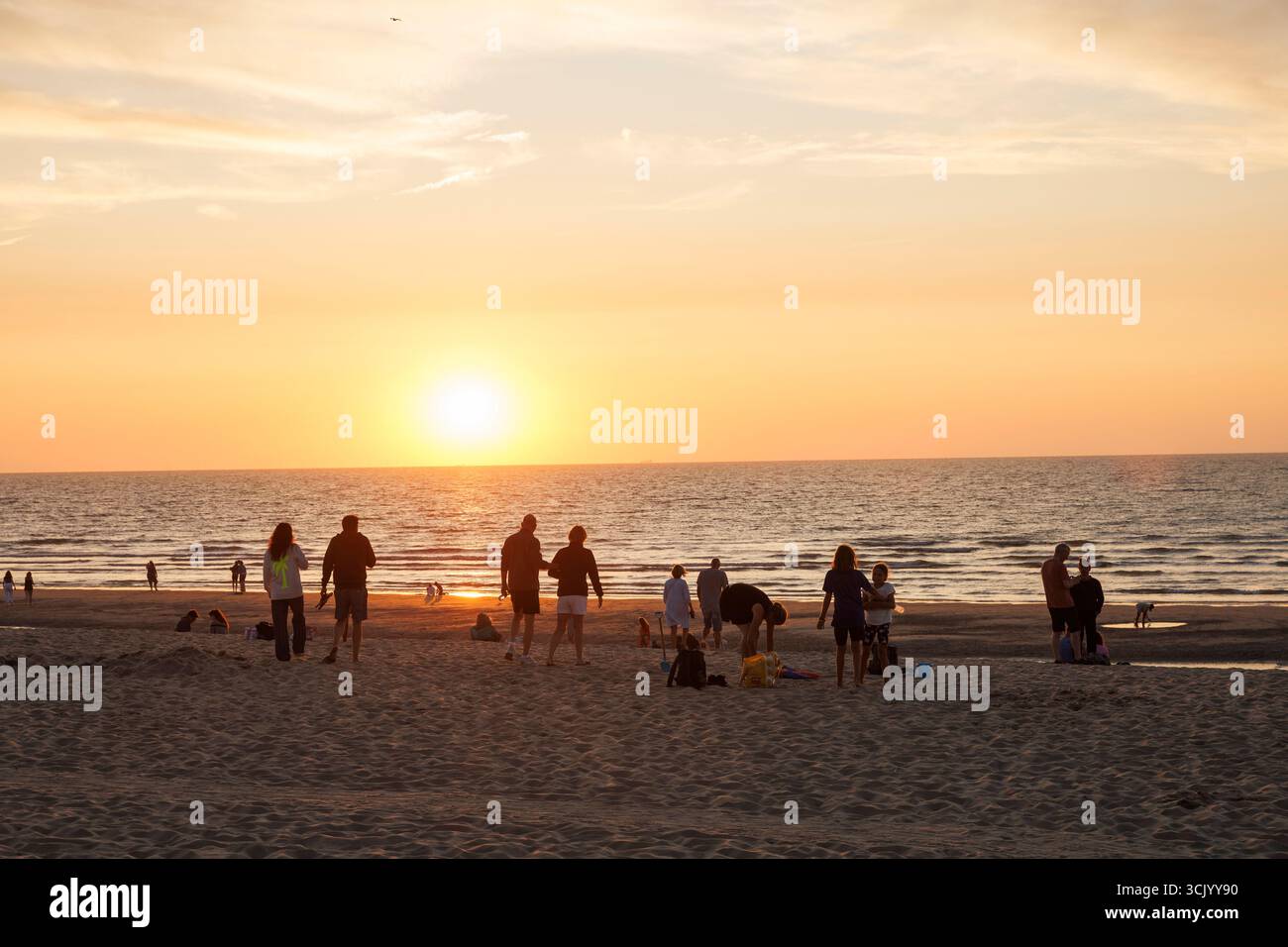 people on the beach in Oostkapelle on the peninsula Walcheren, sunset ...