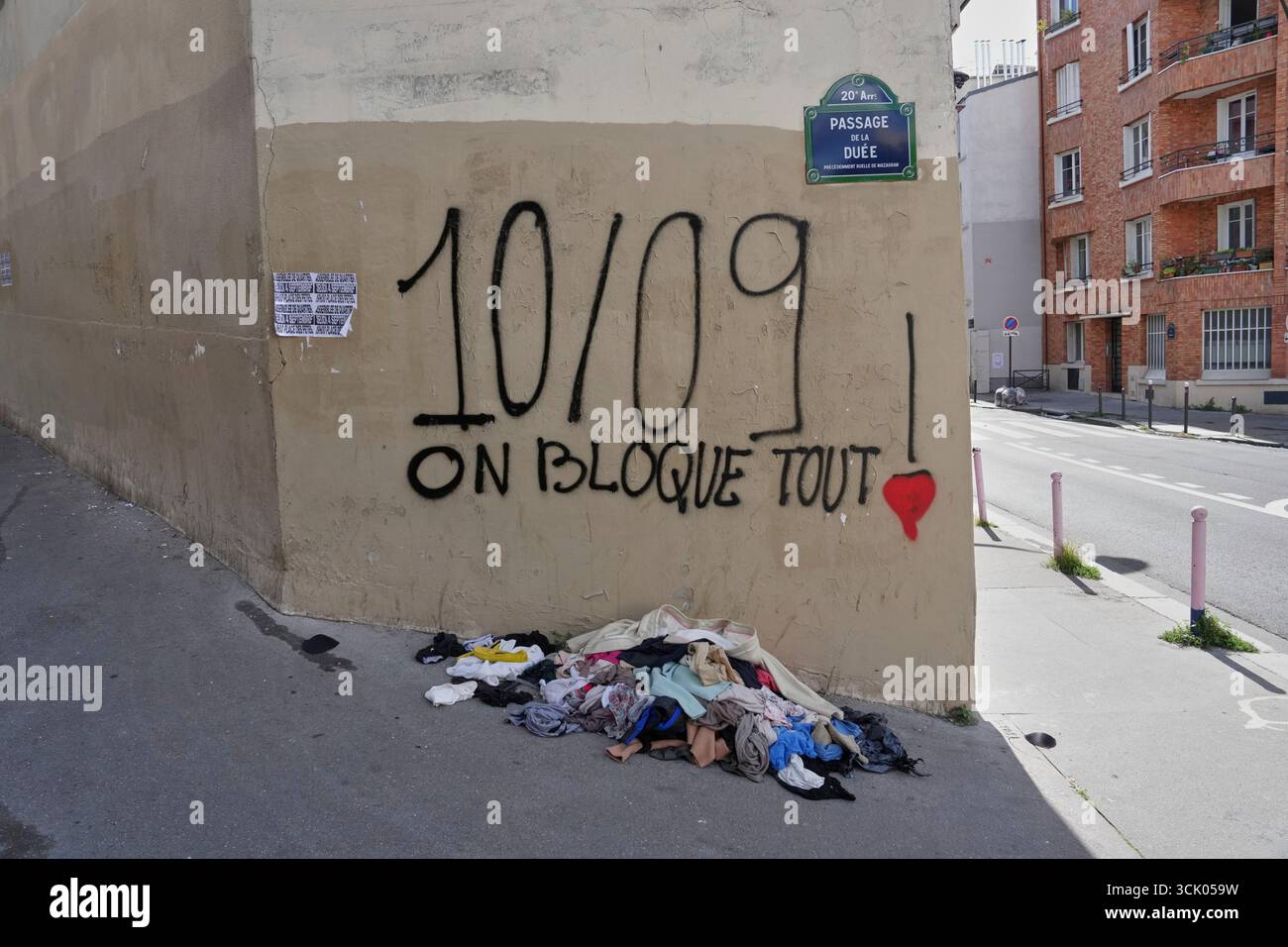 A graffiti reads, "September 10, we shut everything down" in Paris ...