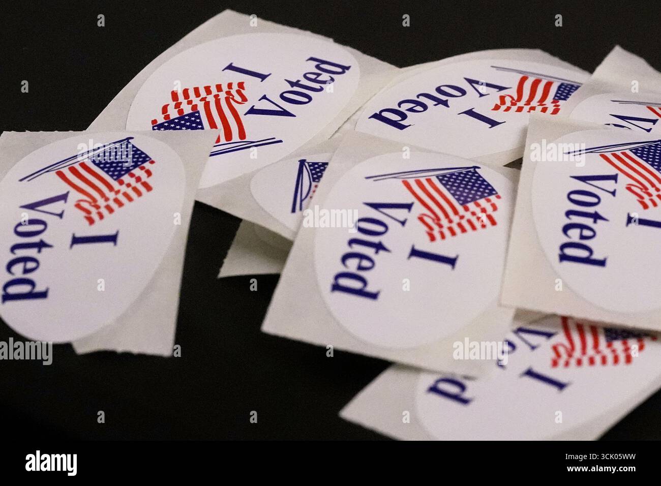 "I Voted" stickers rest on a ballot box at a polling place, Tuesday ...