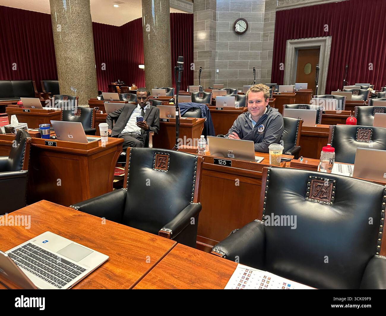 Missouri Democratic state Rep. Ray Reed, left, looks at his phone while ...