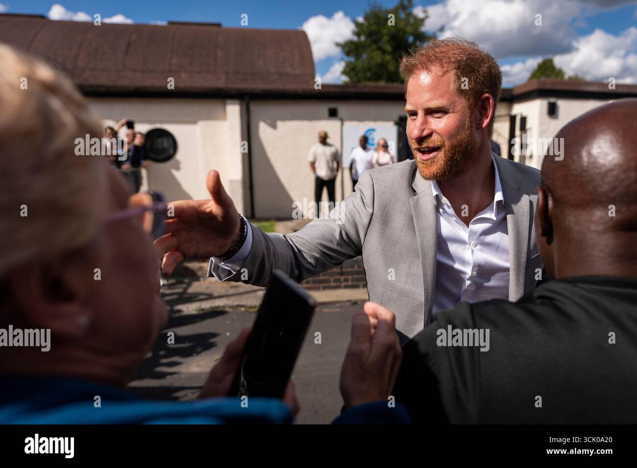 The Duke of Sussex greets members of the public following a visit to ...