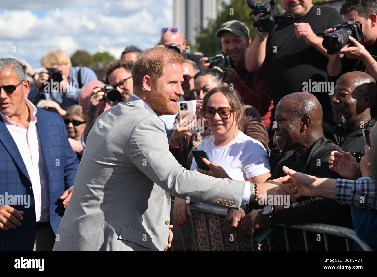 The Duke of Sussex greets members of the public following a visit to ...
