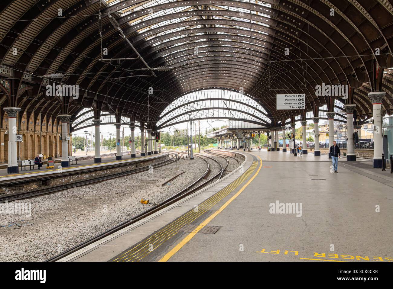 Interior of York railway station in England, with arched glass roof ...