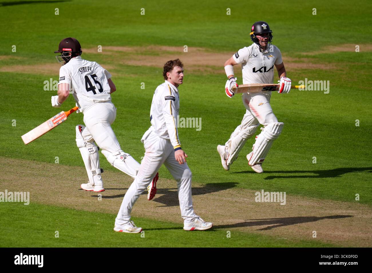 Surrey’s Rory Burns (right) and Dom Sibley run between the wicket ...
