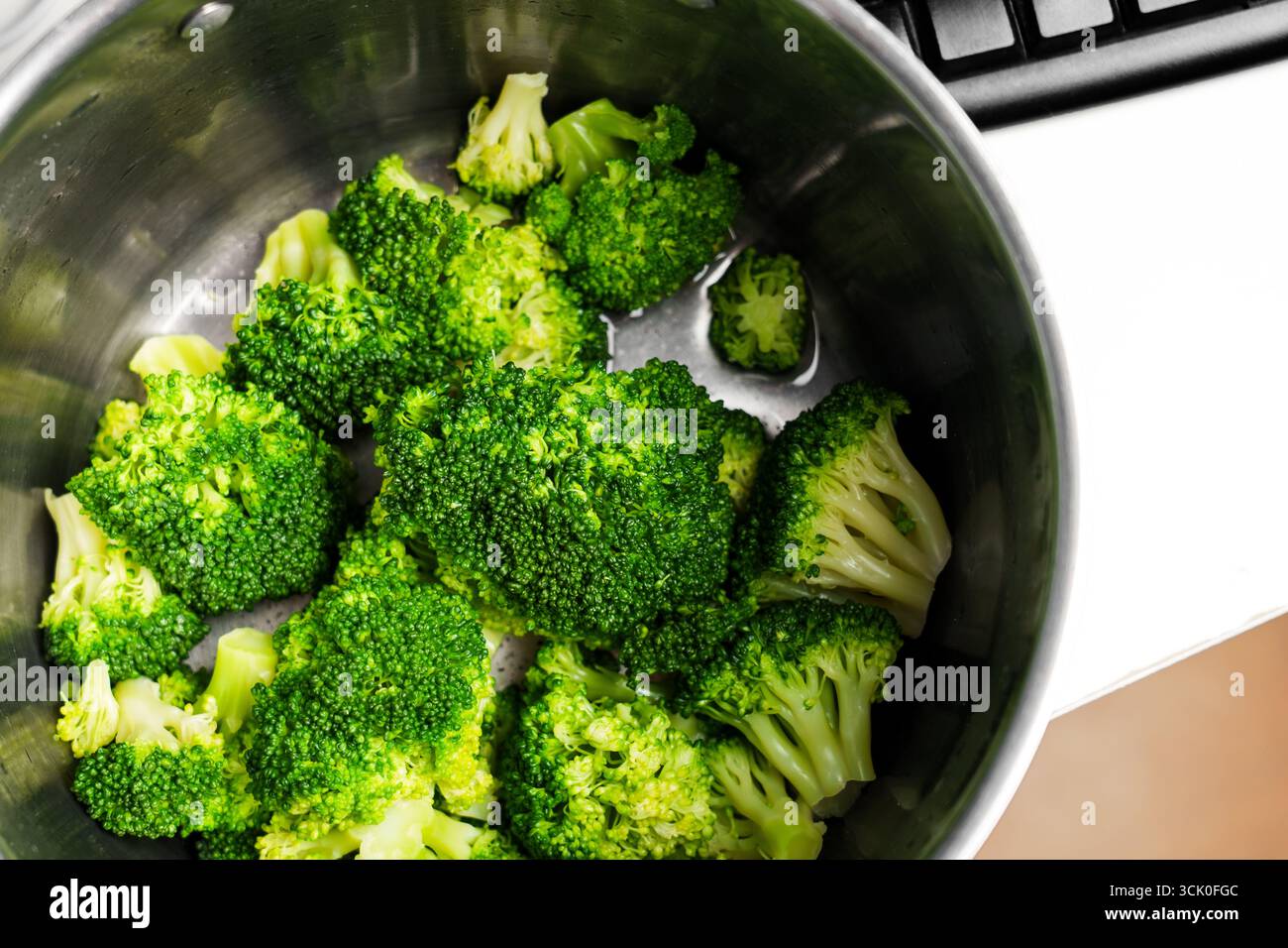 Steamed broccoli in steel saucepan hi-res stock photography and images ...