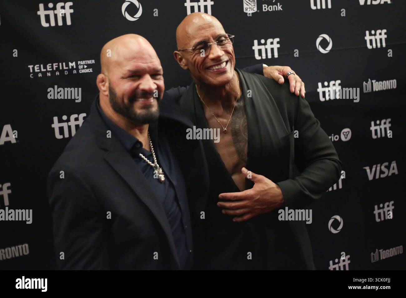 Mark Kerr and Dwayne Johnson attend the premiere of ''Smashing Machine ...