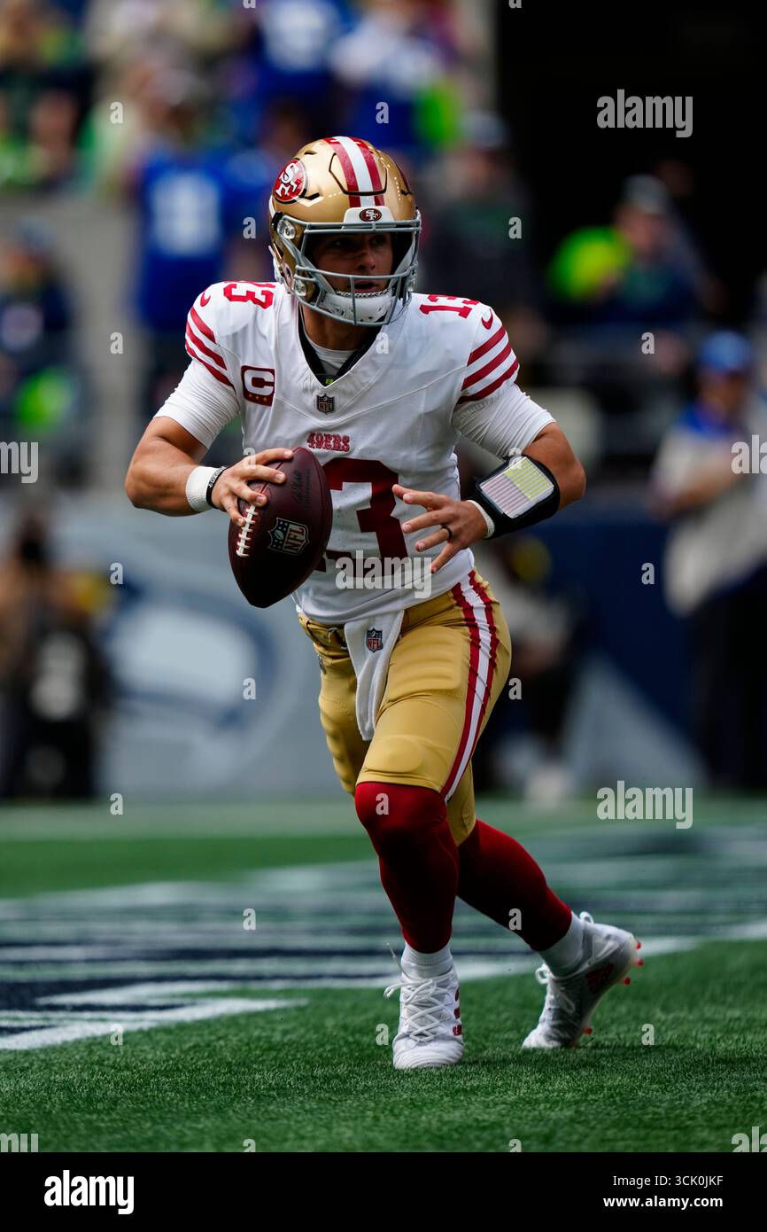San Francisco 49ers quarterback Brock Purdy (13) runs with the ball ...