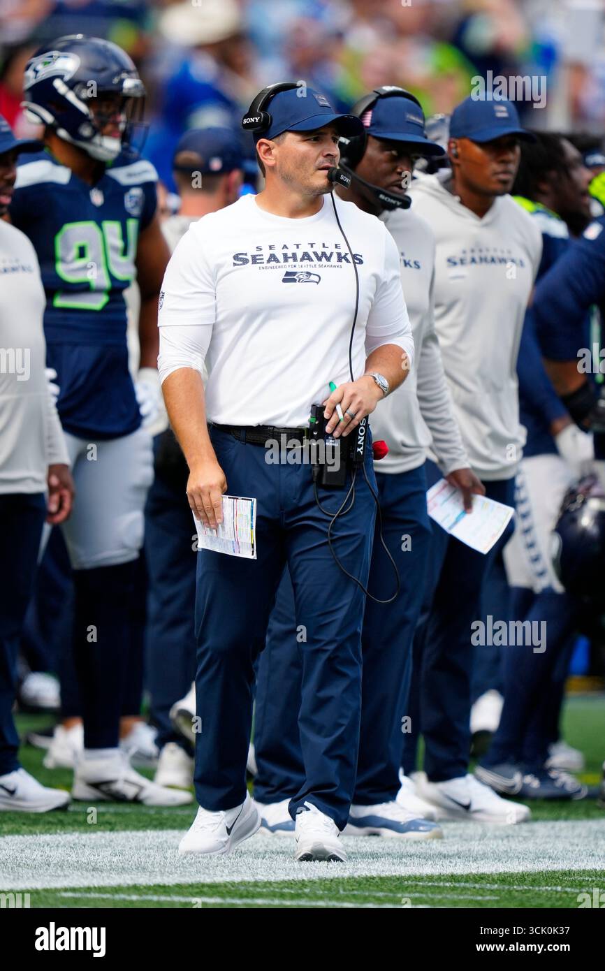 Seattle Seahawks head coach Mike Macdonald looks on while wearing a ...