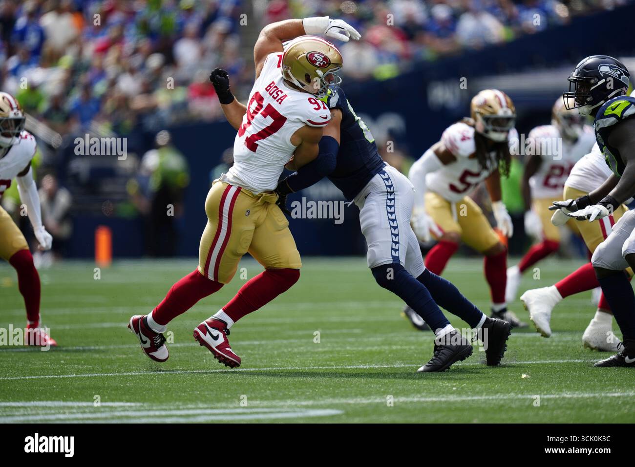San Francisco 49ers defensive end Nick Bosa (97) and Seattle Seahawks ...