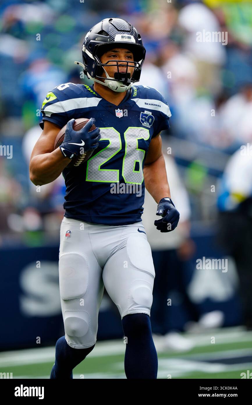 Seattle Seahawks running back Zach Charbonnet (26) runs with the ball ...