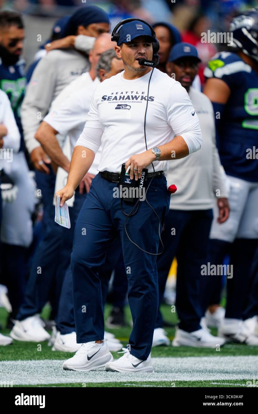 Seattle Seahawks head coach Mike Macdonald looks on while wearing a ...