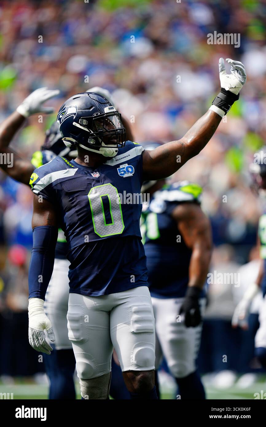 Seattle Seahawks defensive end DeMarcus Lawrence (0) looks on during an ...