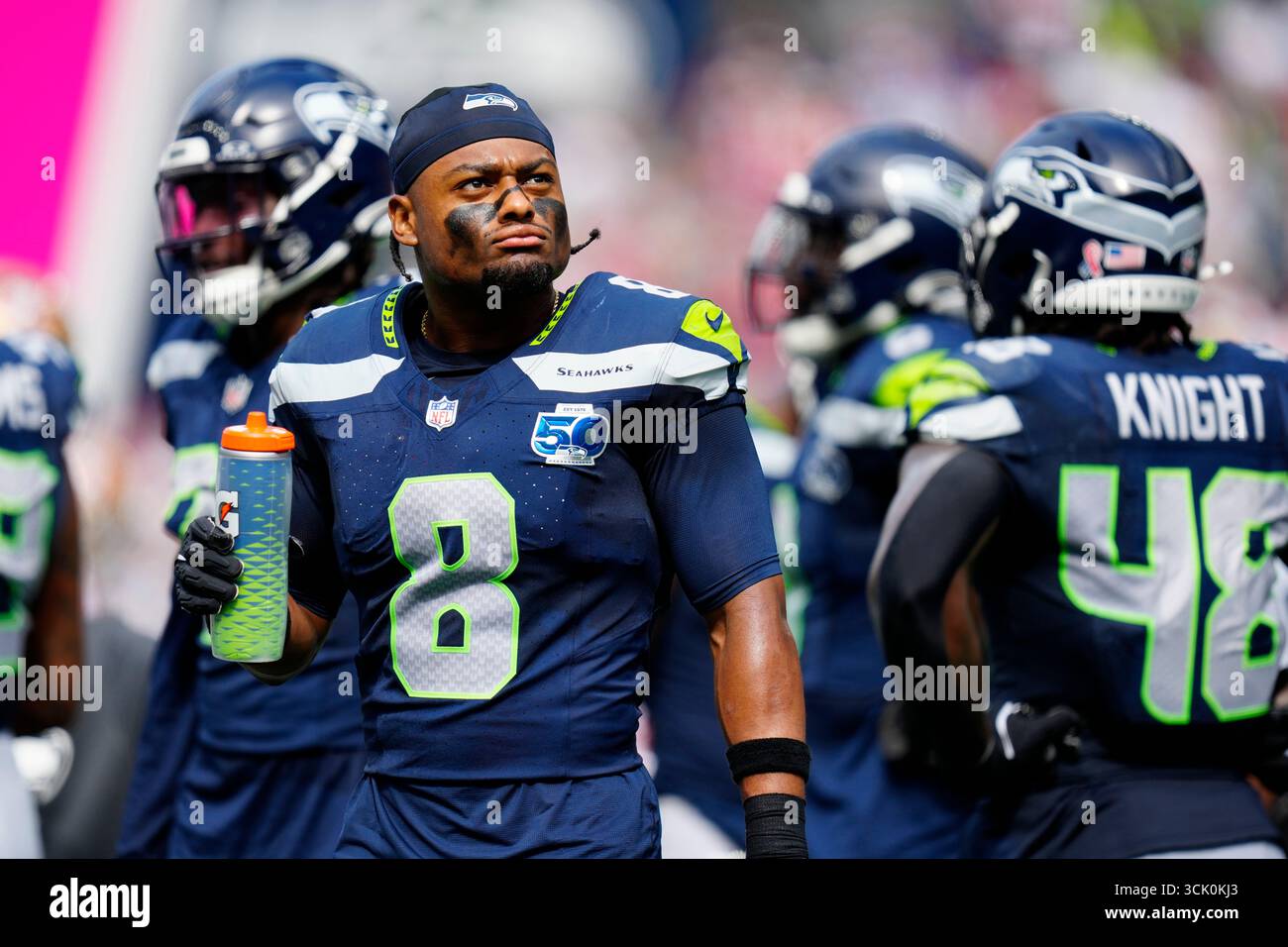 Seattle Seahawks safety Coby Bryant (8) looks on while holding a ...