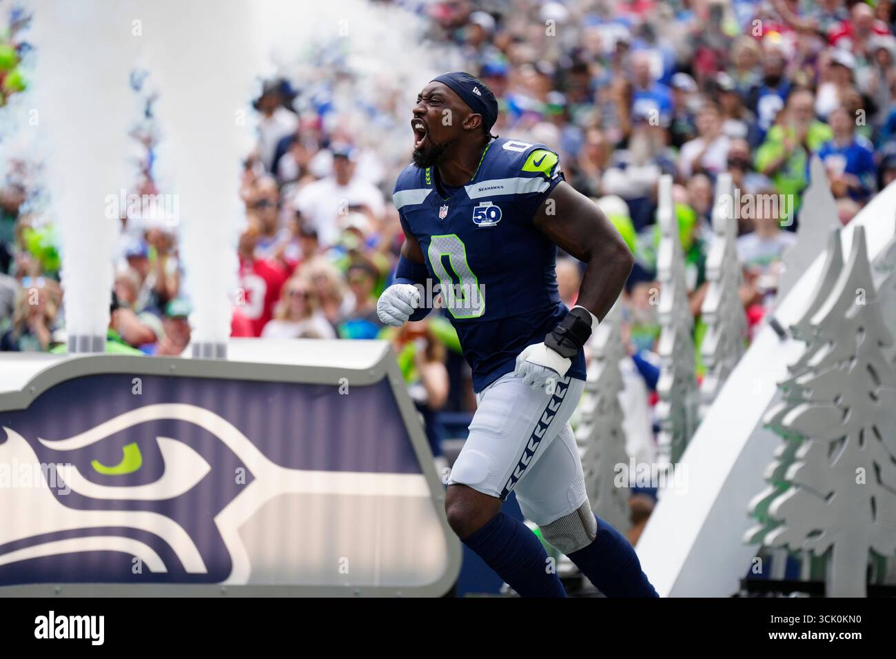 Seattle Seahawks defensive end DeMarcus Lawrence runs out onto the ...