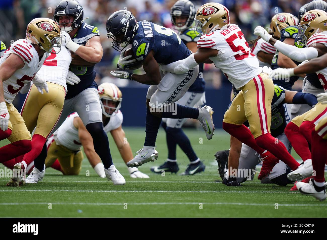San Francisco 49ers linebacker Dee Winters (53) grabs Seattle Seahawks ...