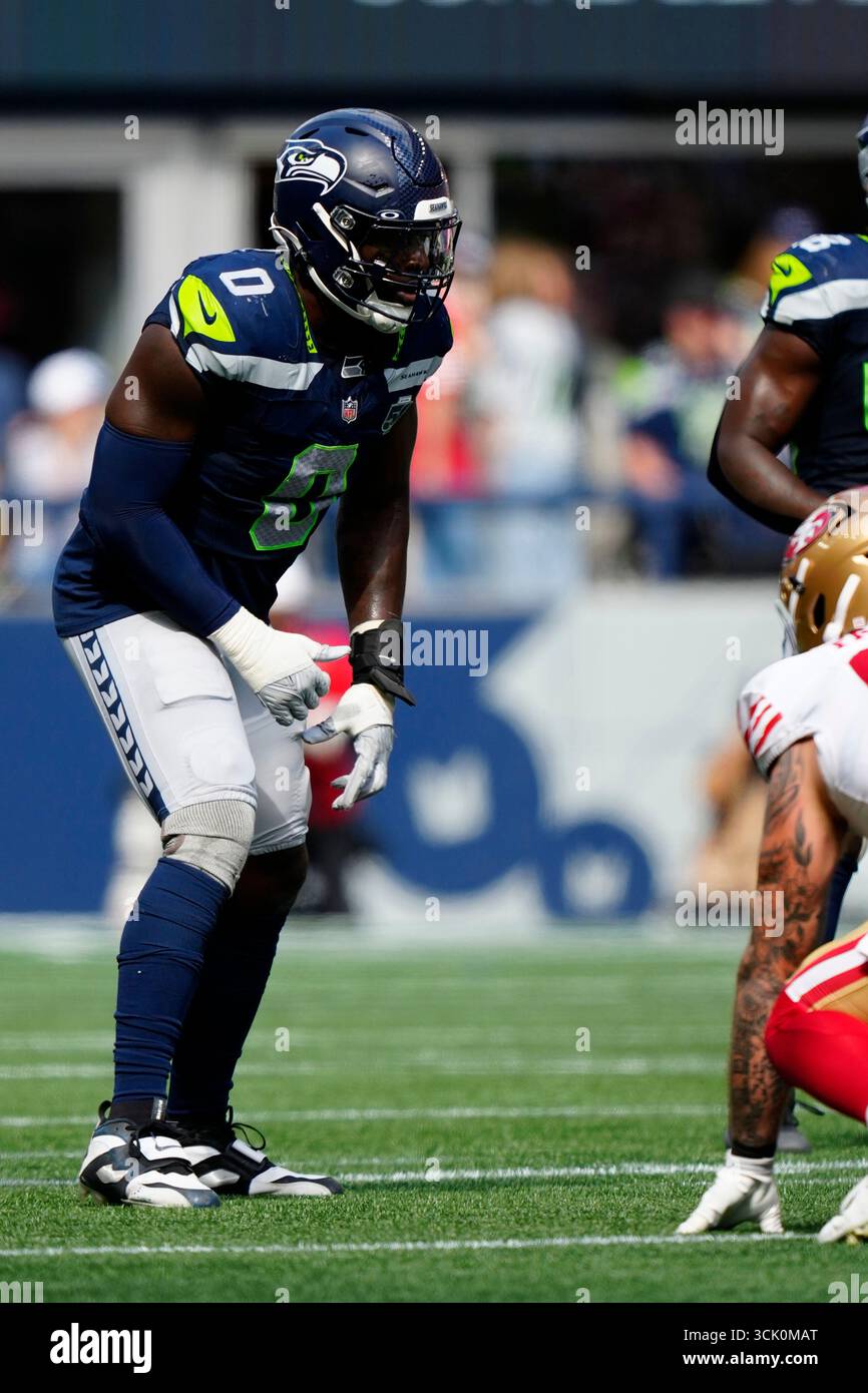 Seattle Seahawks defensive end DeMarcus Lawrence (0) gets set during an ...