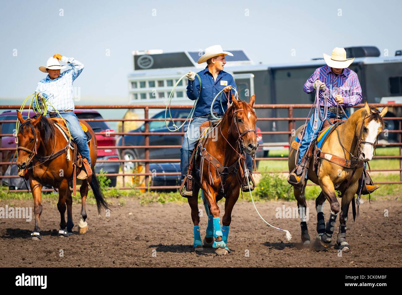 White Shield, ND, USA - July 12 2025: A close-up view of cowboys riding ...