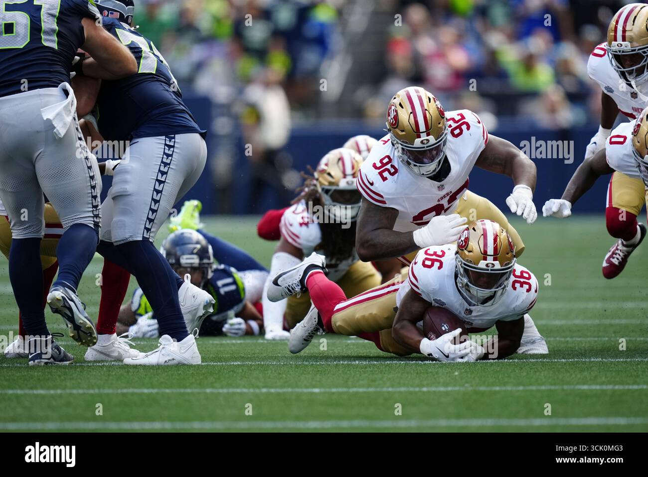 San Francisco 49ers safety Marques Sigle (36) recovers a fumble during ...