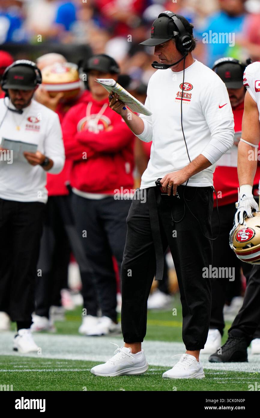 San Francisco 49ers head coach Kyle Shanahan looks at his plays while ...