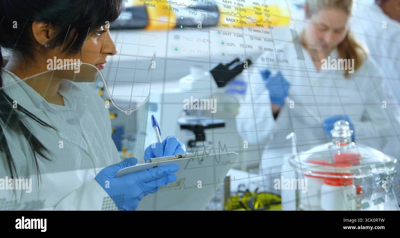 Researcher taking notes in clipboard hi-res stock photography and ...