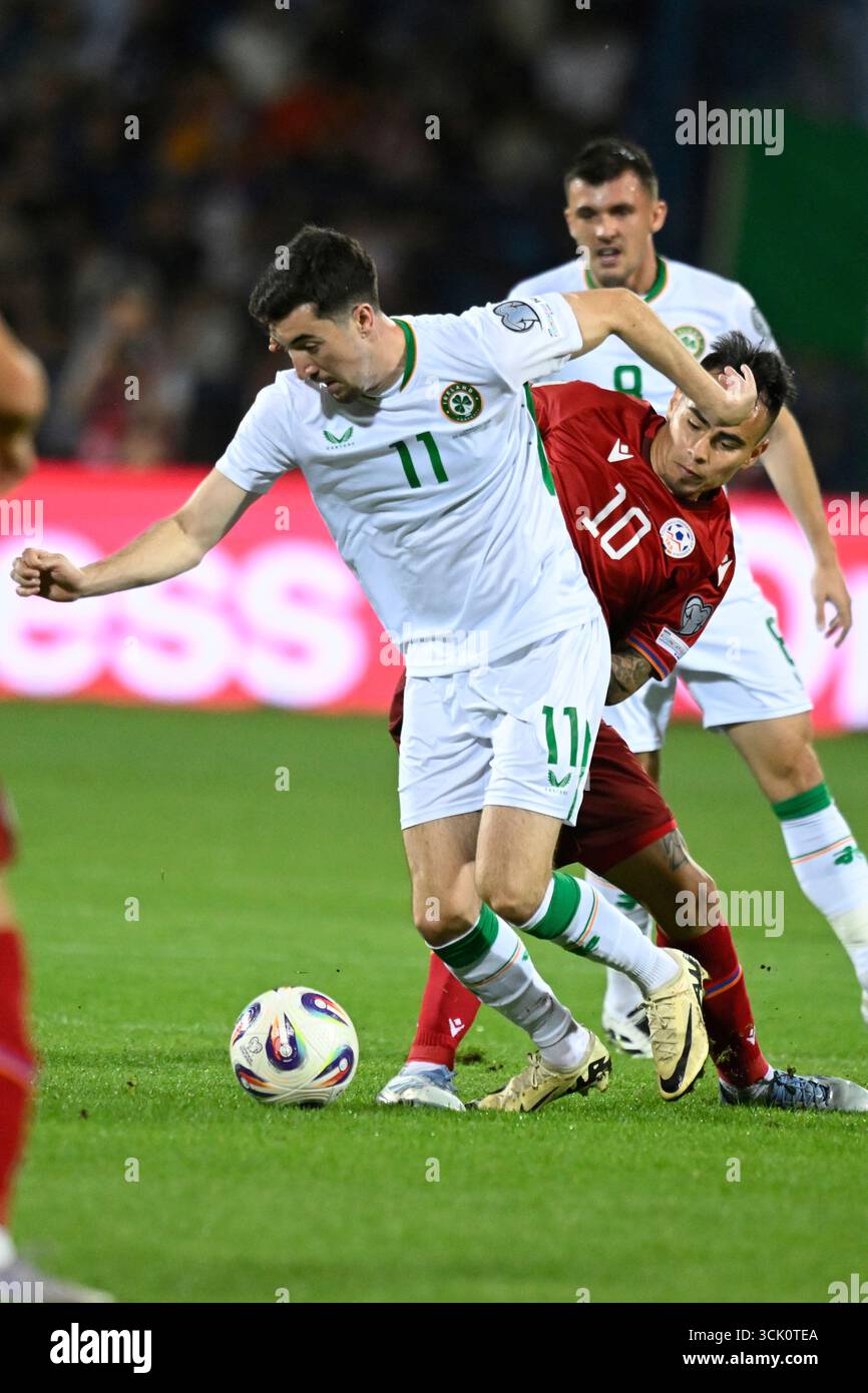 Ireland's Finn Azaz, left, fights for the ball with Armenia's Lucas ...