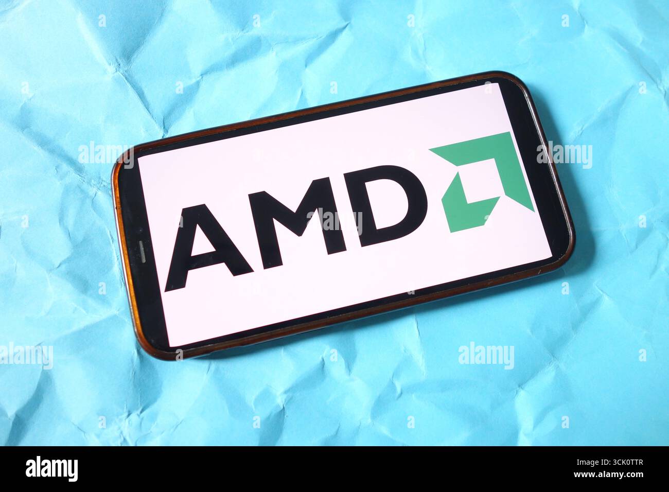 In this photo illustration, the AMD Advanced Micro Devices company logo is seen displayed on a ...