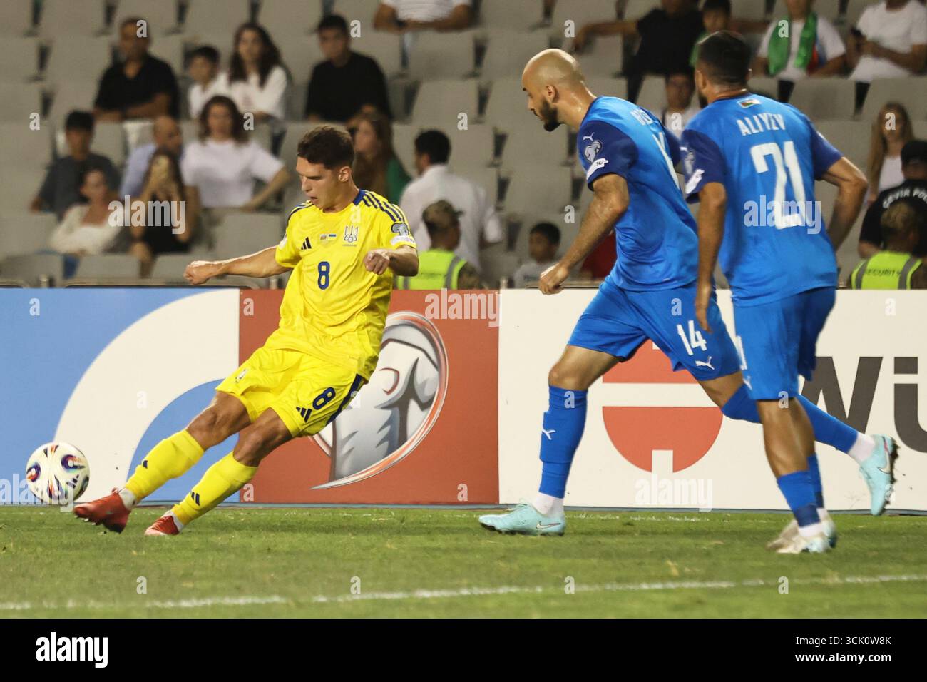 Ukraine's Georgiy Sudakov, left, passes the ball during the World Cup ...