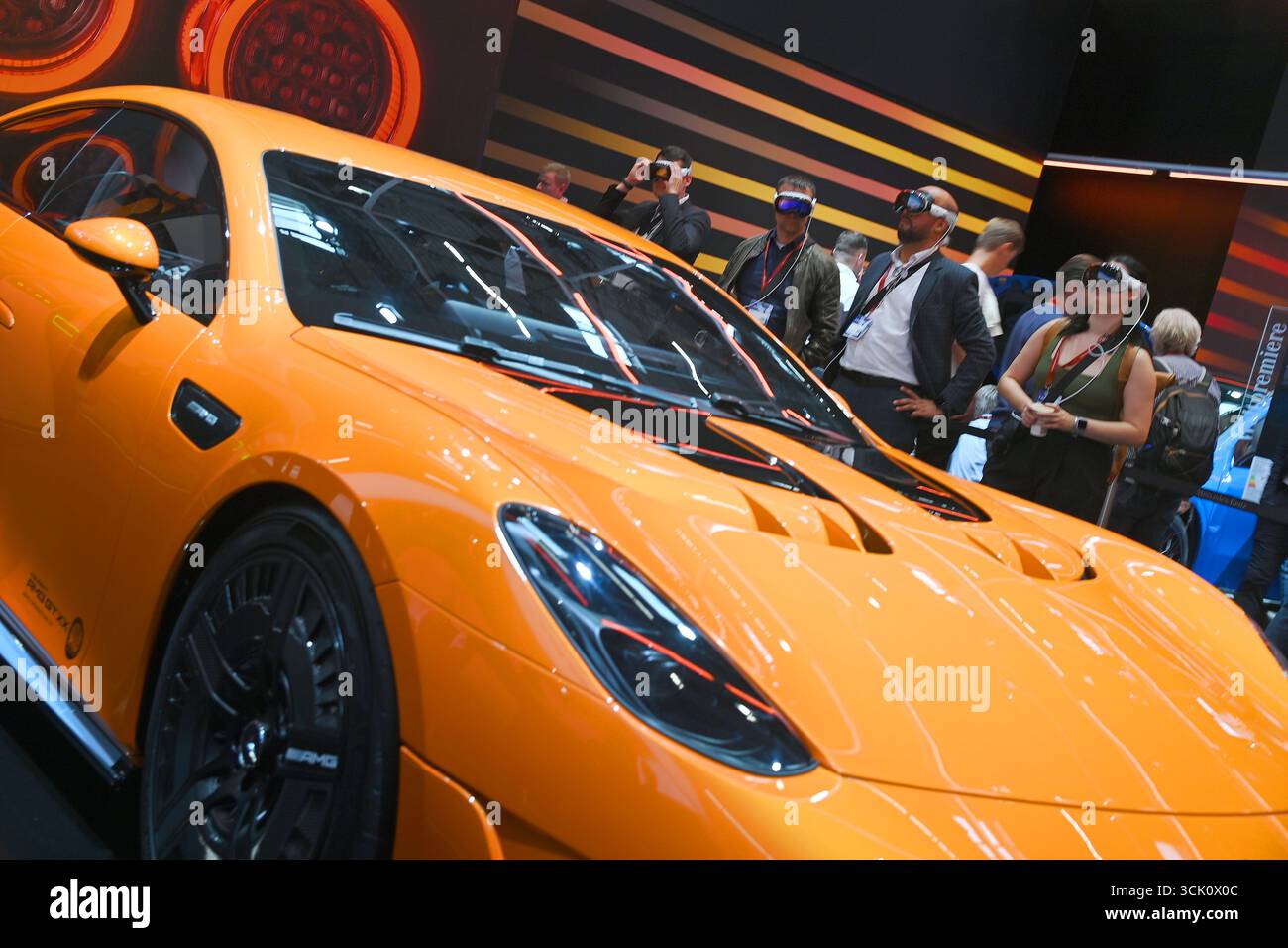 Mercedes-Benz booth with AMG concept car. People and visitors with ...