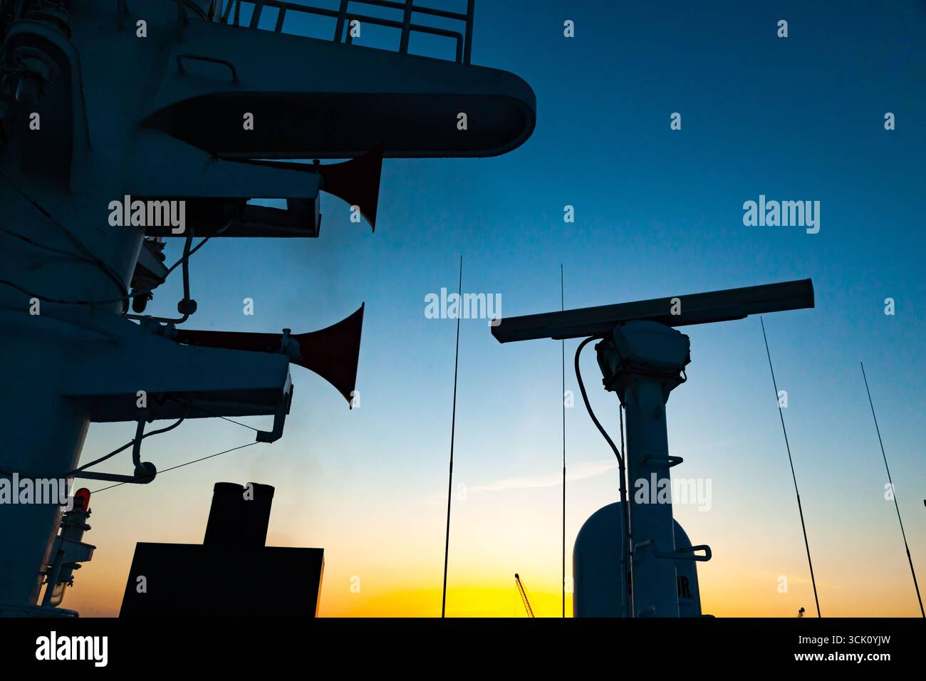 Silhouette of the mast of a cargo ship with navigation equipment, view ...